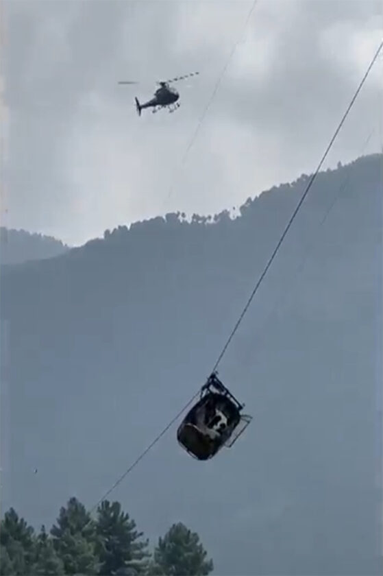 Rescuers save 8 people trapped in cable car dangling above canyon in ...